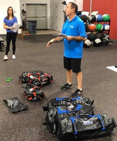 9 Ultimate Sandbag Exercises That Make Functional Strength Better ...